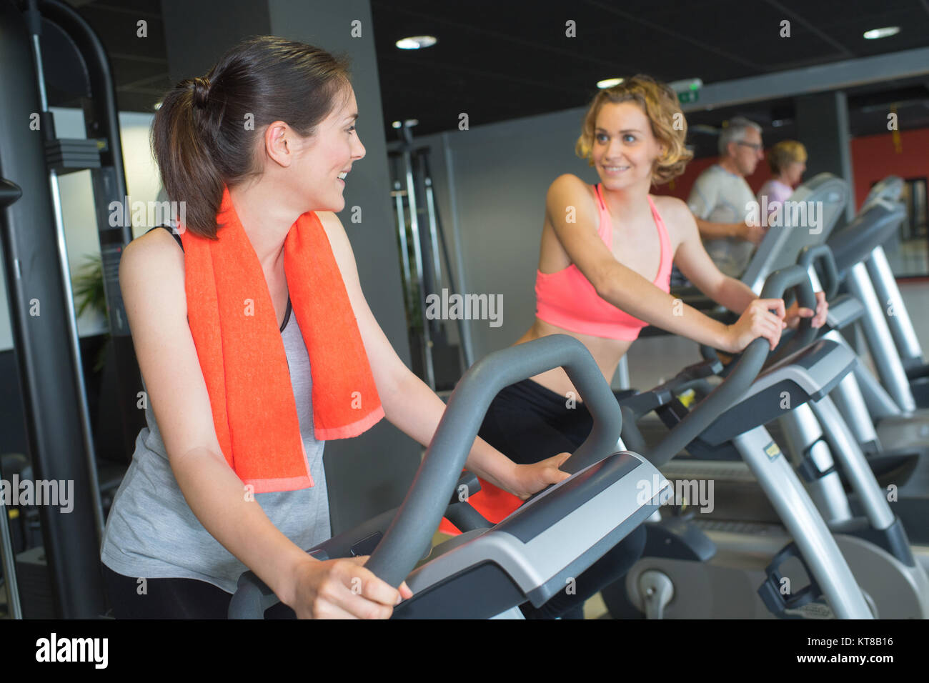 young women doing exercises on treadmill Stock Photo - Alamy