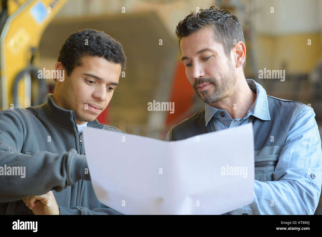two workers workers in warehouse Stock Photo - Alamy