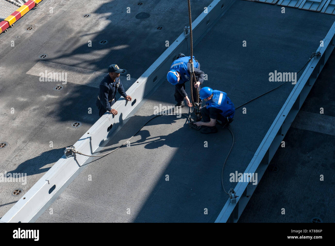 Servicemen at work aboard US navy aircraft carrier Stock Photo - Alamy