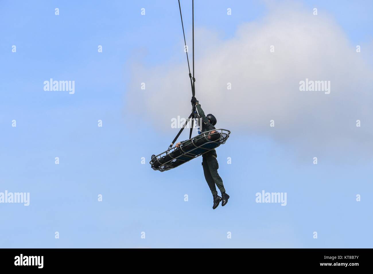 Soldier rescue emergency by army helicopter with rope on blue sky Stock ...