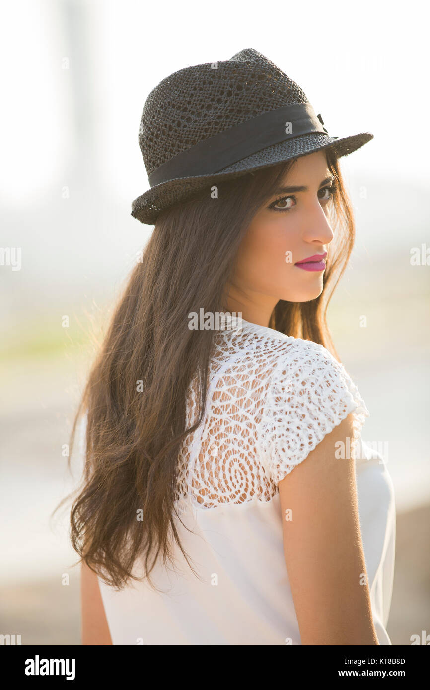 Woman looking over shoulder unhappy hi-res stock photography and images ...