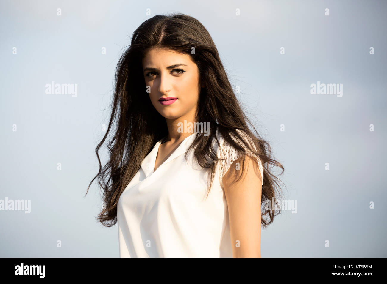 Serious young woman staring outdoors Stock Photo - Alamy