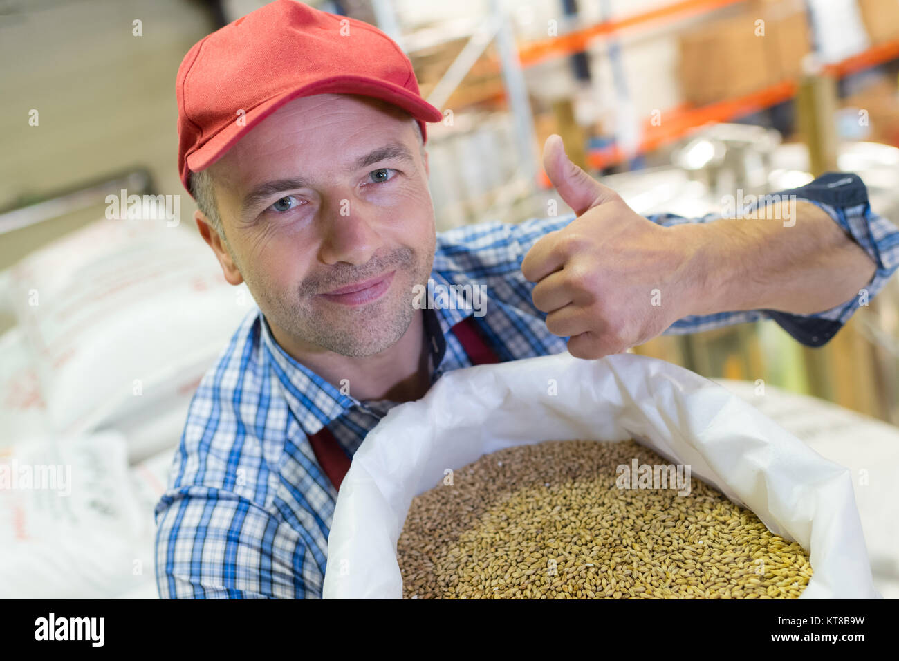 grain quality inspector showing a thumbs up Stock Photo - Alamy