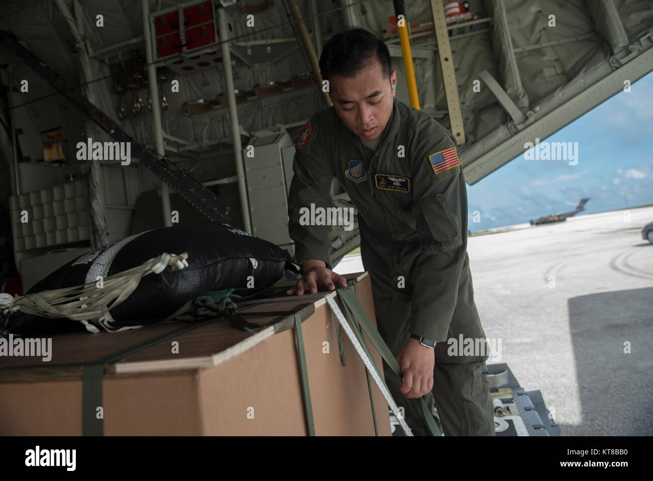 Staff Sgt. Joseph Arcega, a loadmaster with the 36th Airlift Squadron ...