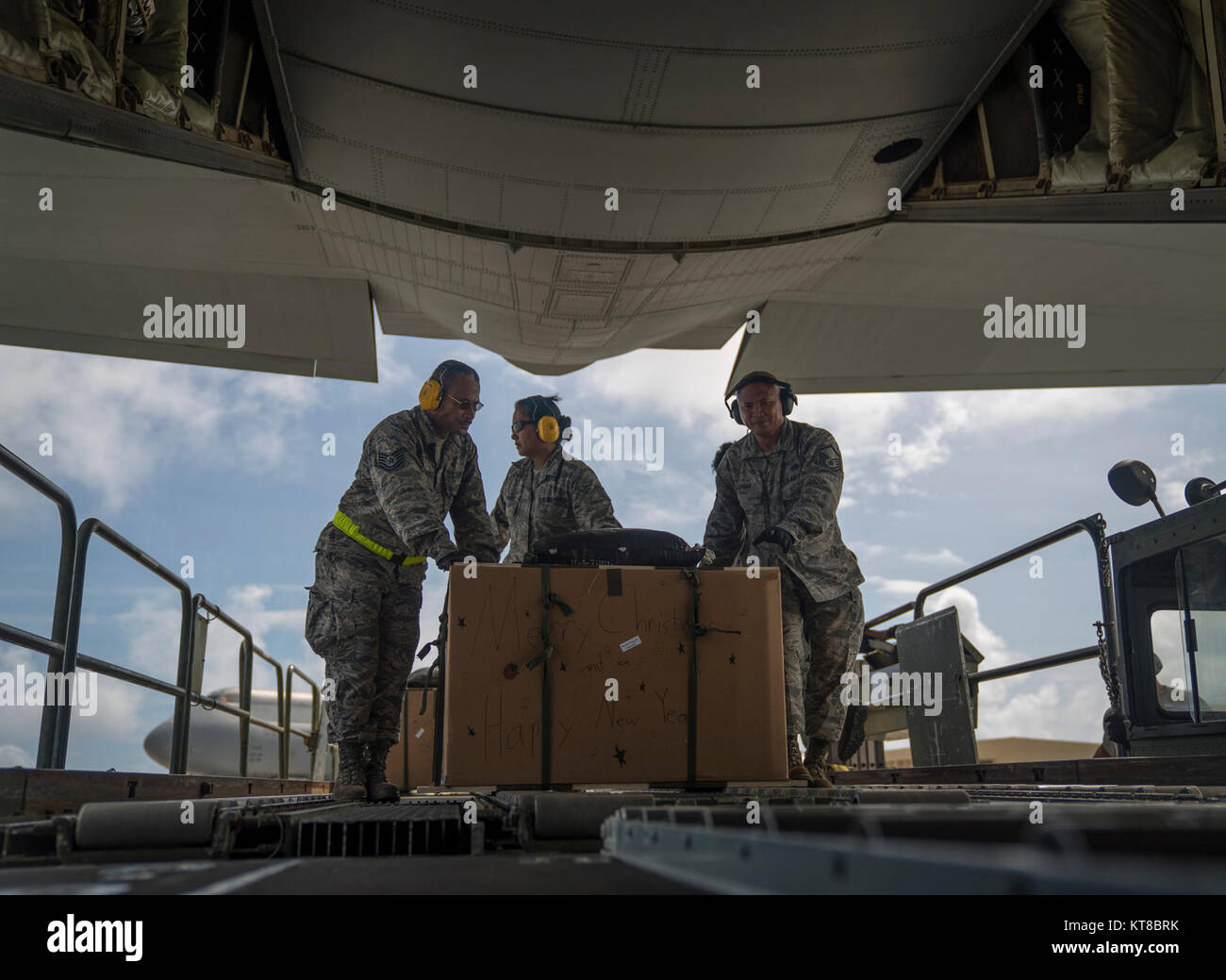 Airmen from the 44th Aerial Port Squadron load pallets onto a C-130J ...