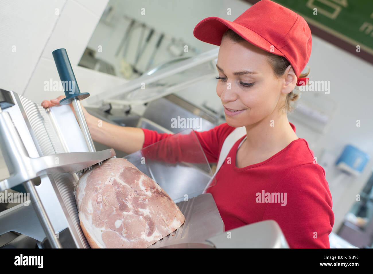 female butcher cutting meat Stock Photo - Alamy