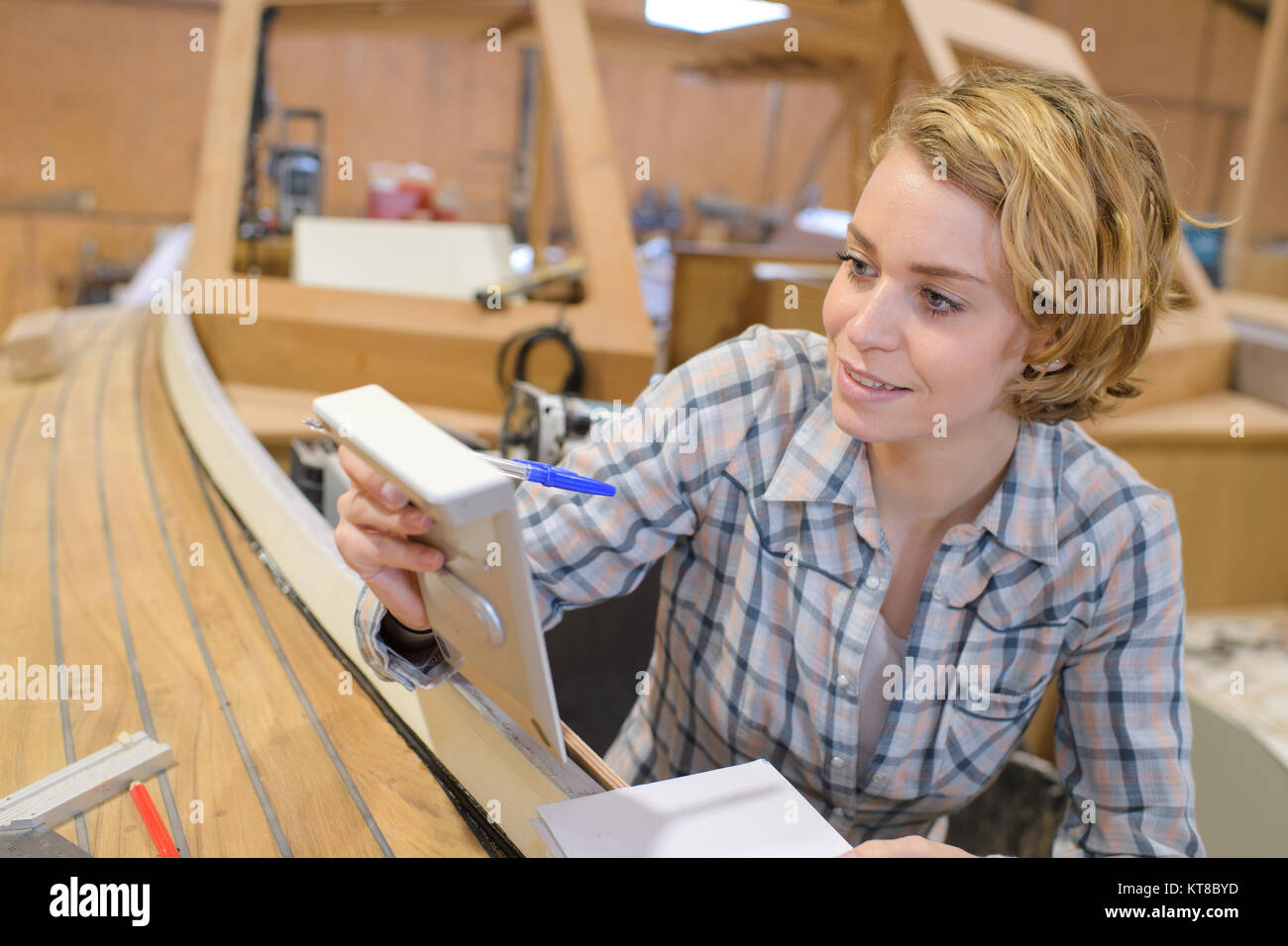 woman working in a boat workshop Stock Photo - Alamy