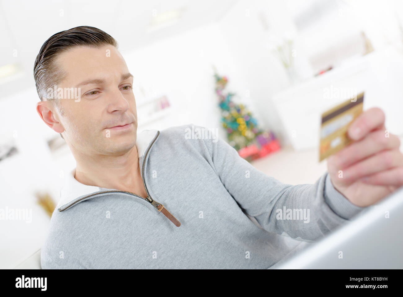 man reading the card information Stock Photo - Alamy
