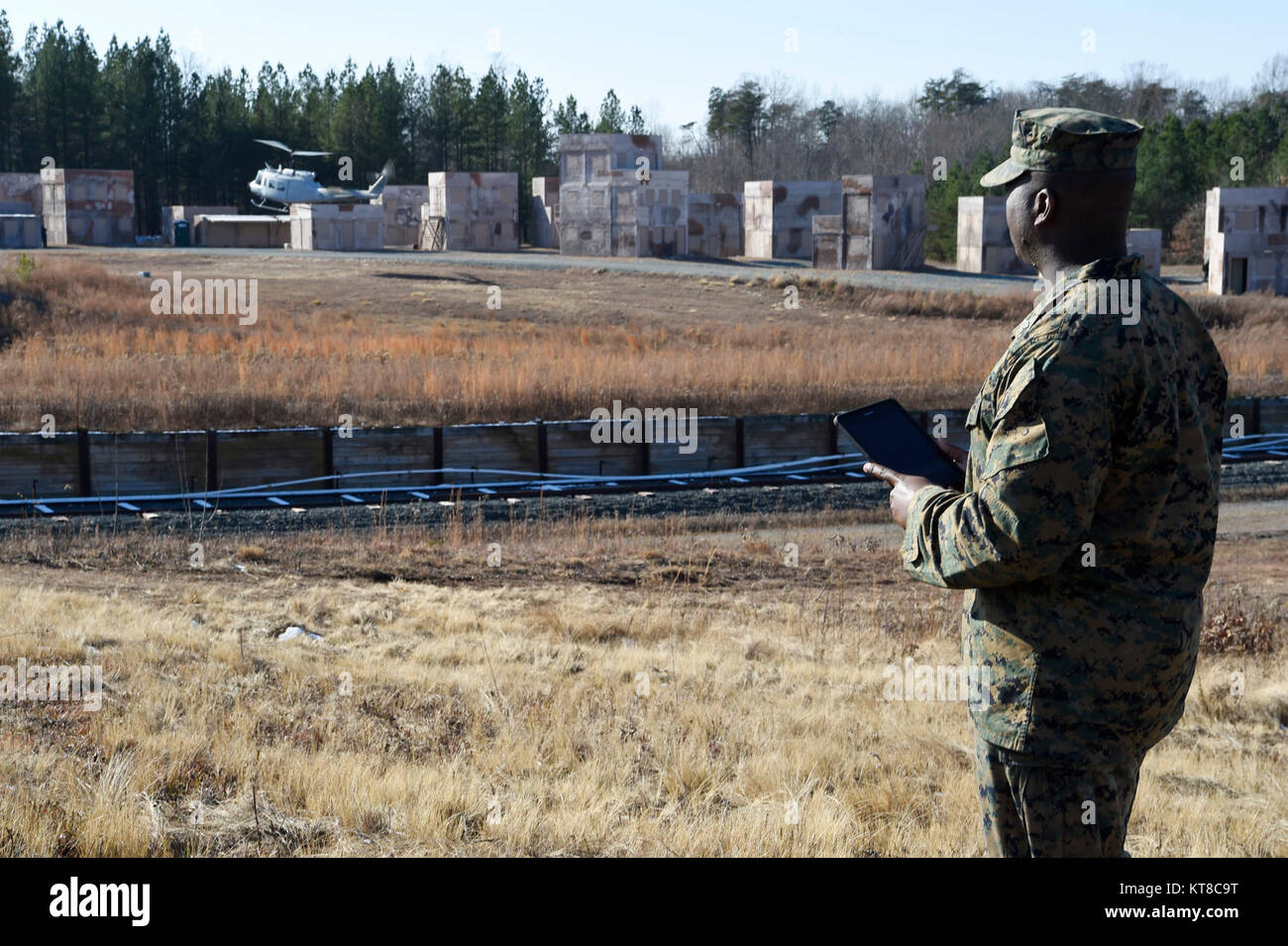 Sgt. Dionte Jones uses a handheld tablet to request resupply from a UH ...