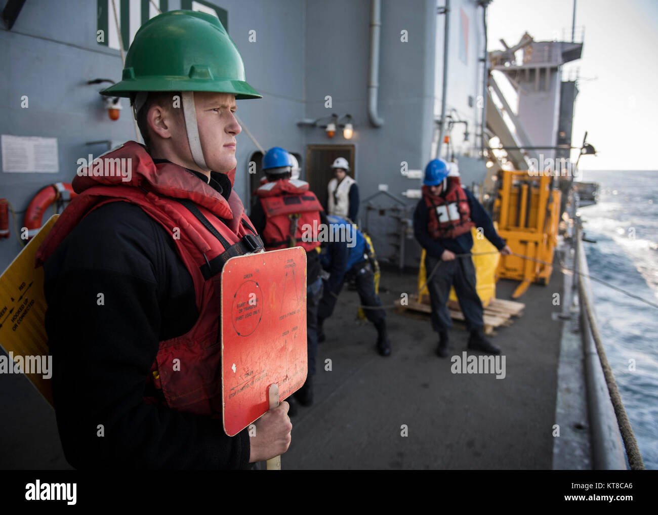 Seaman Ryan Boddie stands as a signalman during an alongside connected ...