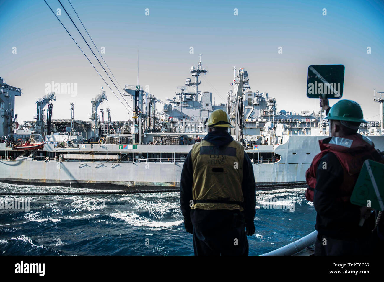Boatswain's Mate 2nd Class Michael Piatt, left, and Seaman Ryan Boddie ...