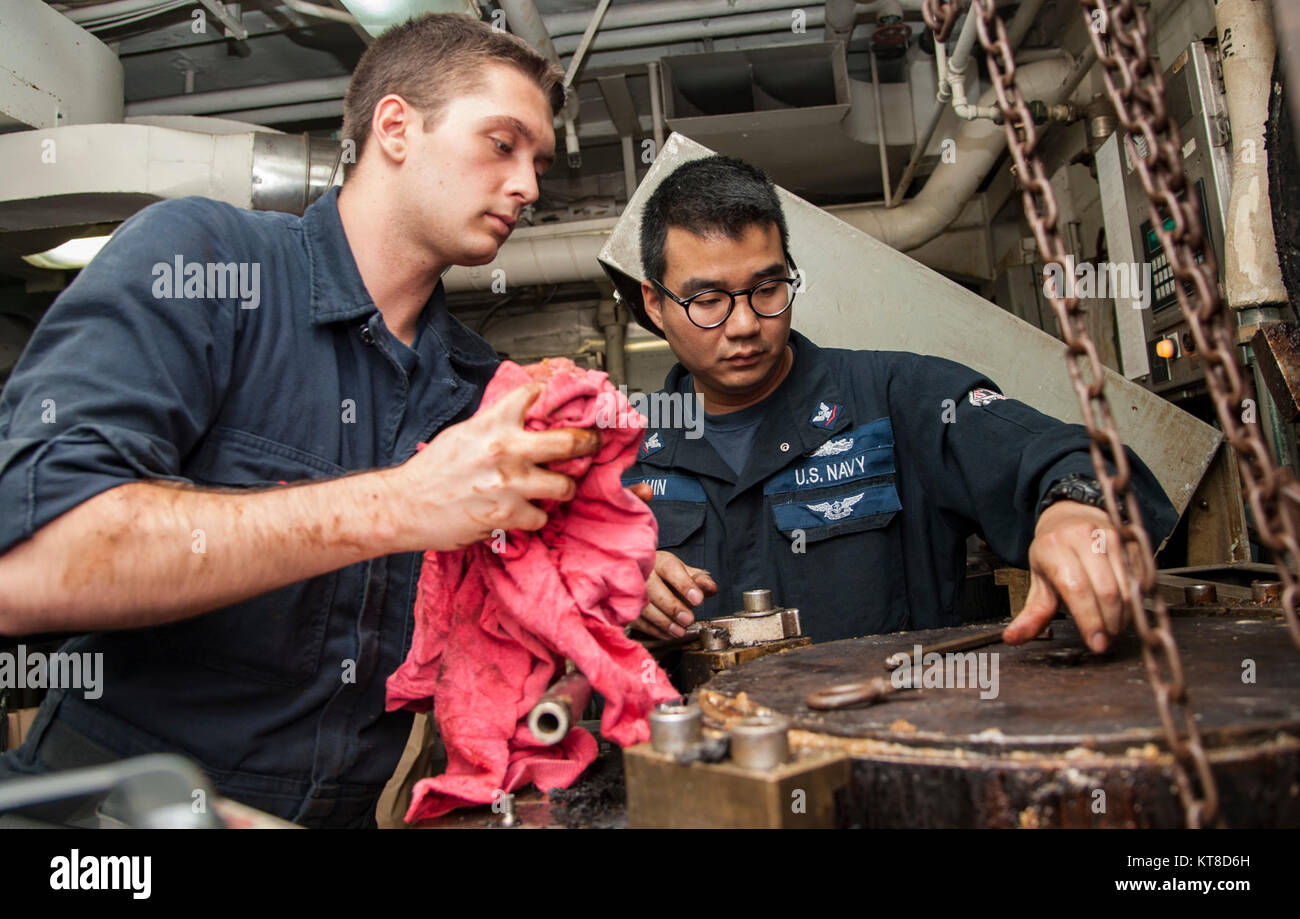 Machinist Mate 3rd Class Jung Shin and Fireman Tristan Fadeley conduct ...