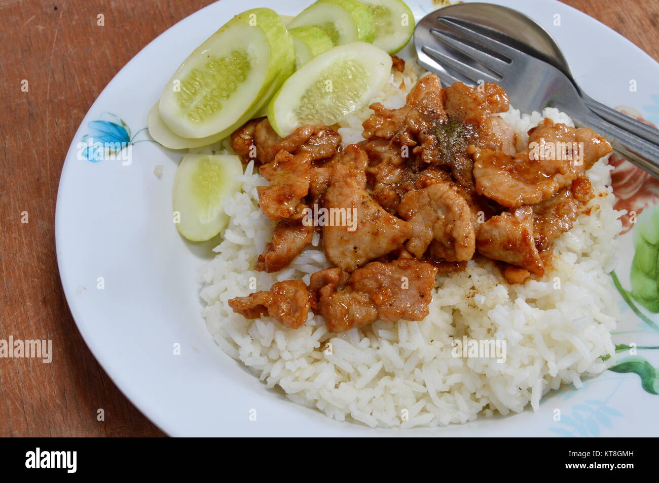 fried pork with garlic and pepper on plain rice Stock Photo - Alamy
