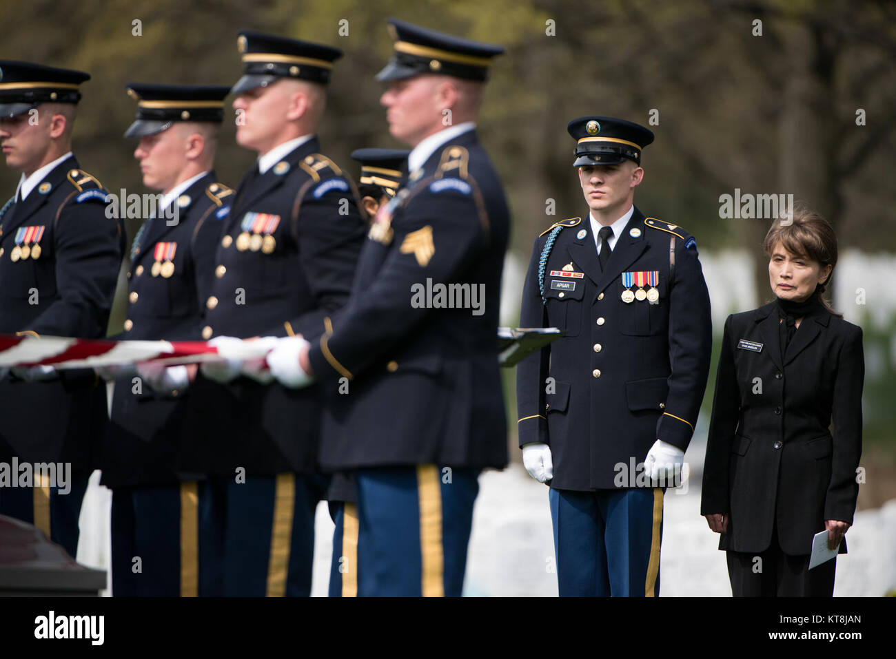 Army Arlington Lady Chae Wheeler participates in the graveside service ...