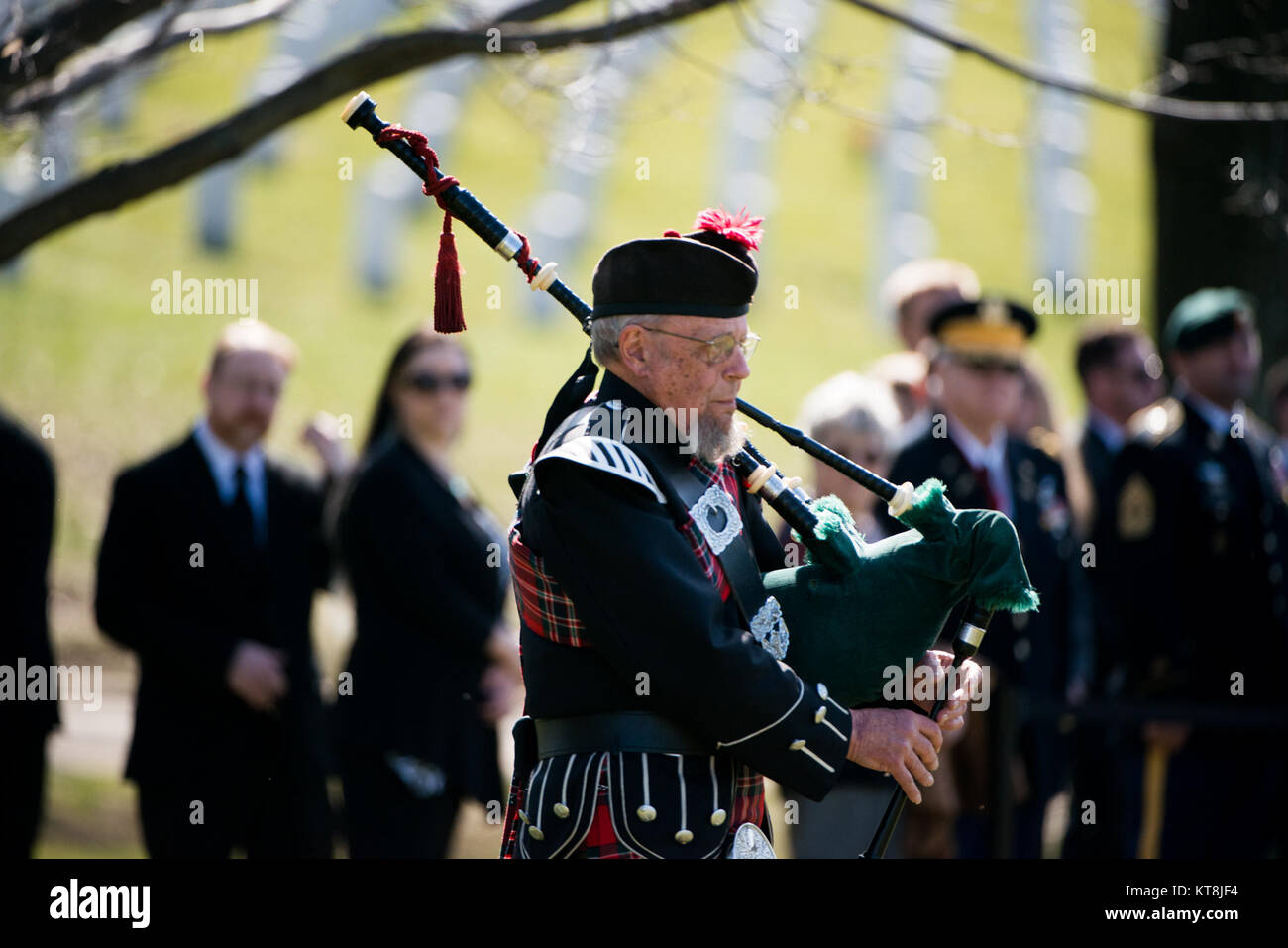 A bagpiper plays during the graveside service of U.S. Army Sgt. First ...