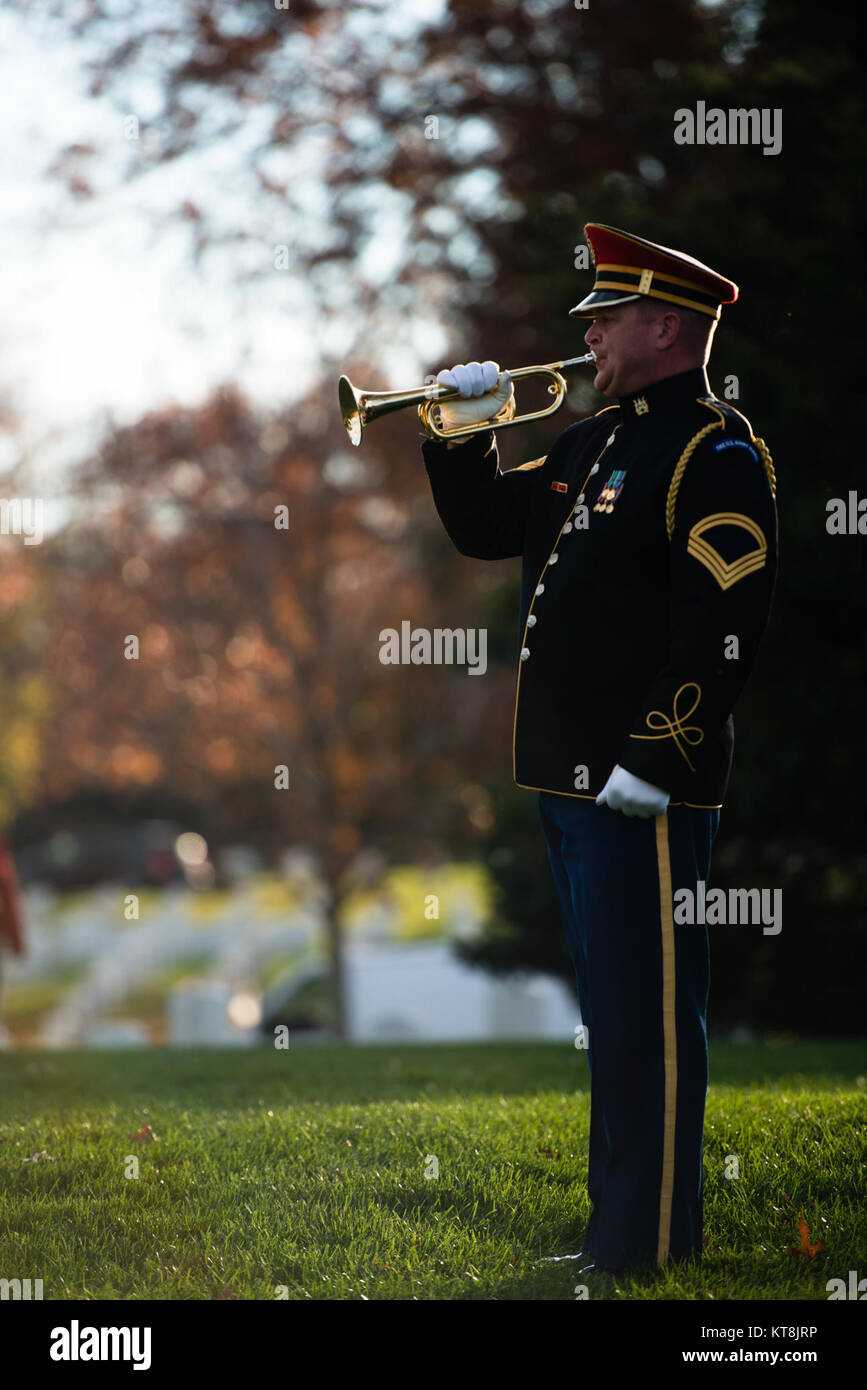 A bugler from The U.S. Army Band “Pershing’s Own” plays Taps during a ...