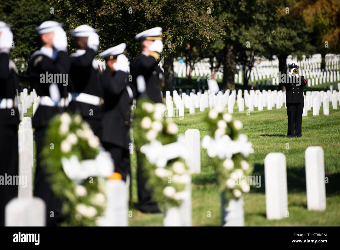 A bugler plays Taps in Arlington National Cemetery, Arlington, Va., Oct ...