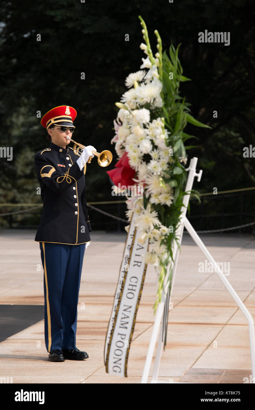 A bugler from The U.S. Army Band, “Pershing’s Own,” plays Taps during a ...
