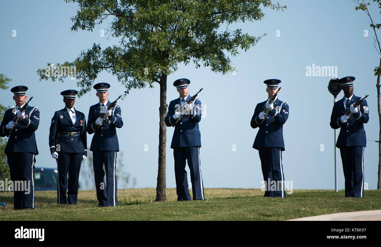 Members of the U.S. Air Force Honor Guard rifle team fire a three-rifle ...