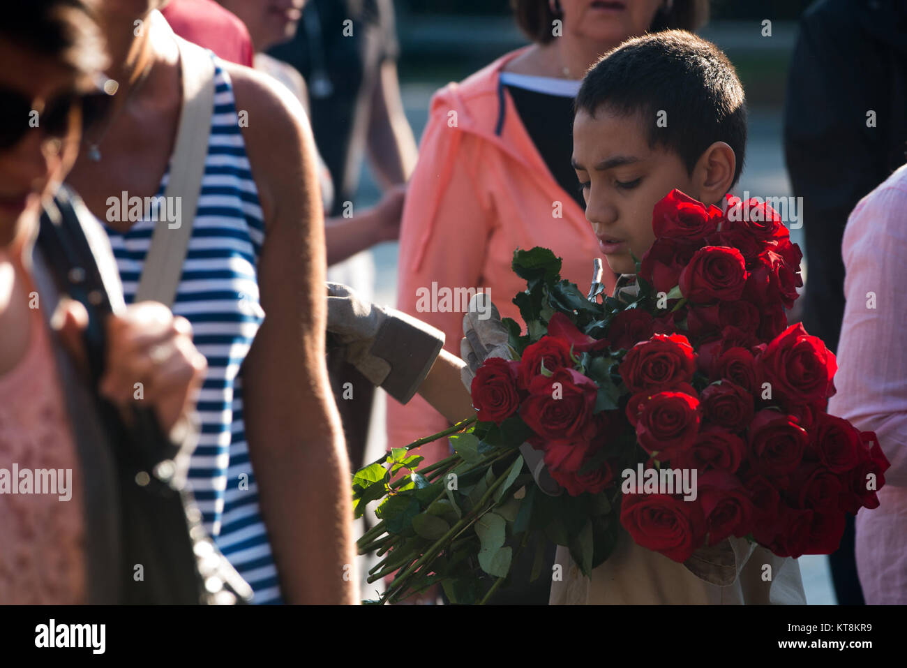 Dylan Finch, 10, with Boy Scout Troop 976 out of Vienna, Va., hands ...