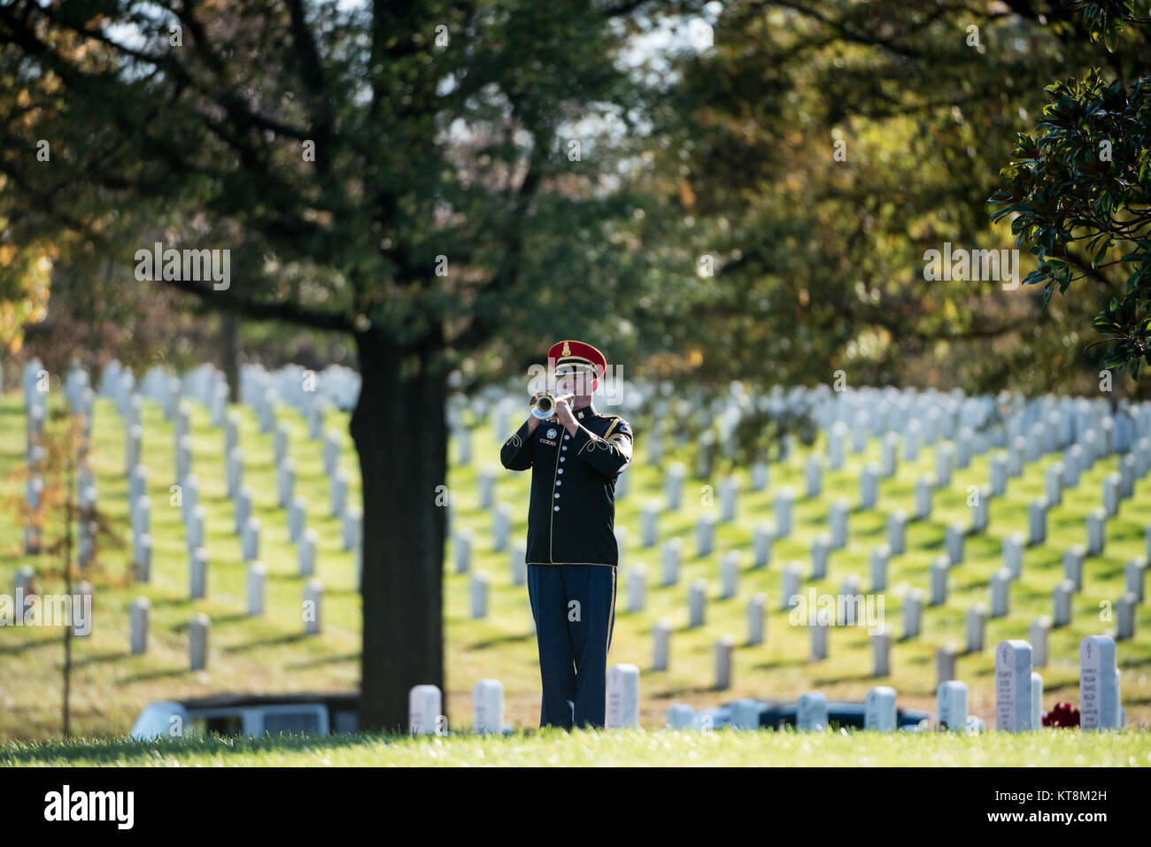 A bugler from The U.S. Army Band, “Pershing’s Own”, plaus taps during ...
