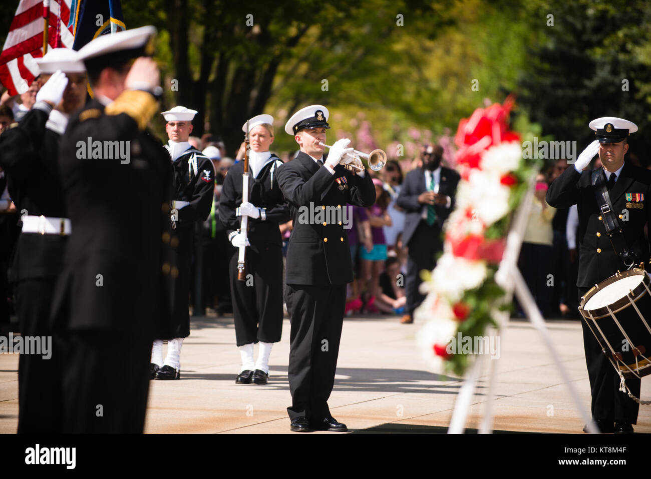 An U.S. Navy bugler plays taps during a ceremony where Vice Adm. Mark ...