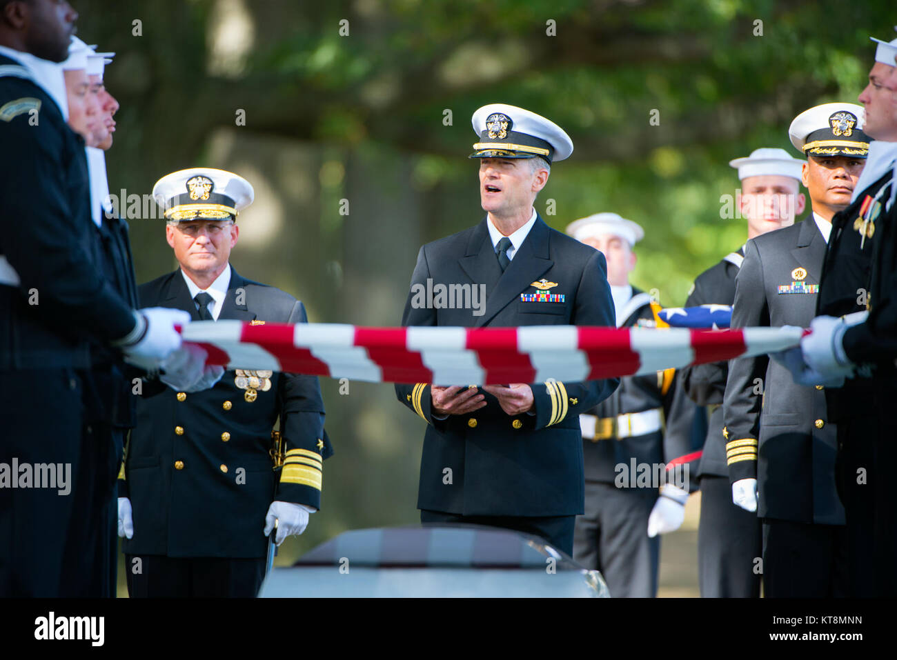 A U.S. Navy Chaplain gives remarks during the graveside service of U.S ...