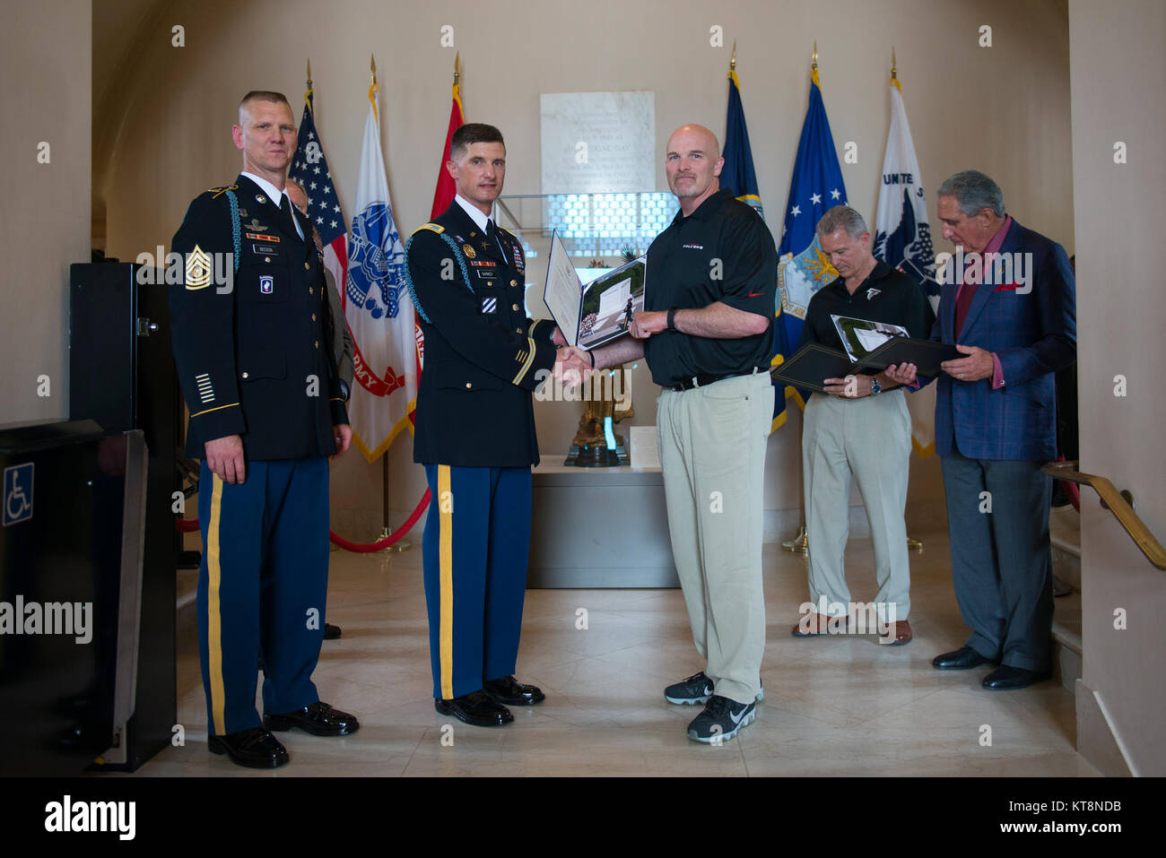 Members of the Atlanta Falcons front office lay a wreath at the Tomb of ...