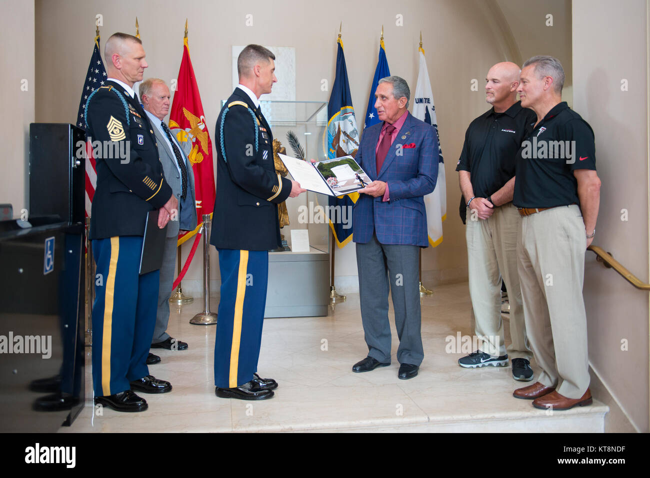 Members of the Atlanta Falcons front office lay a wreath at the Tomb of ...