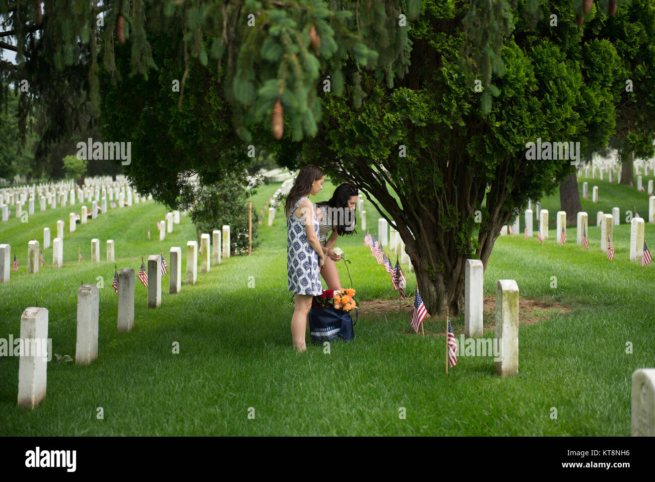 Madeline Foltz and Erin Balderson lay roses at headstones in Arlington ...