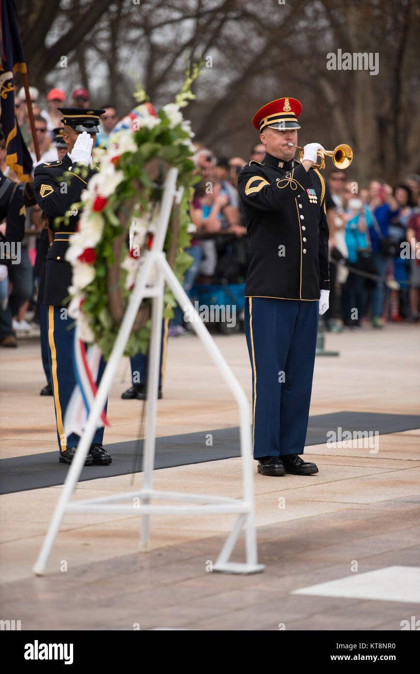 Members of the U.S. Army Band, “Pershing’s Own,” play Taps during a ...
