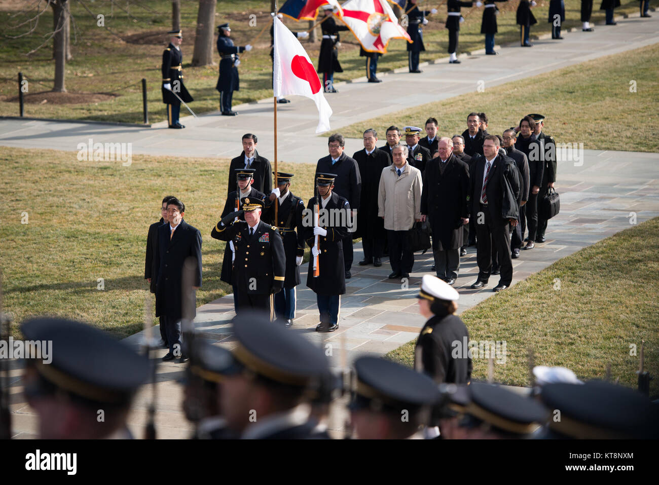 Shinzo Abe, left, prime minster of Japan, is escorted by Maj. Gen. Mark ...