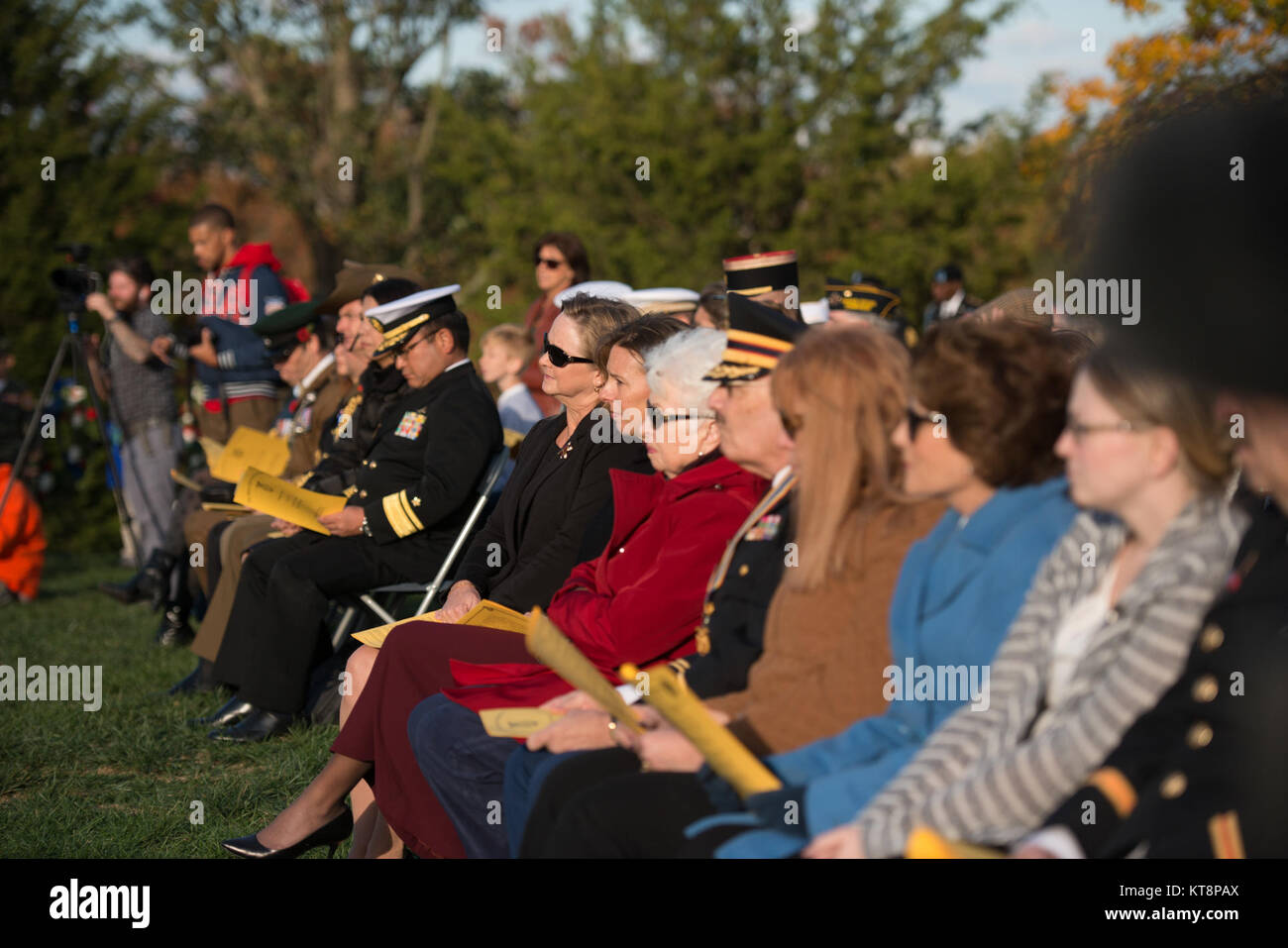 Attendees listen to speakers during a memorial service for General of ...