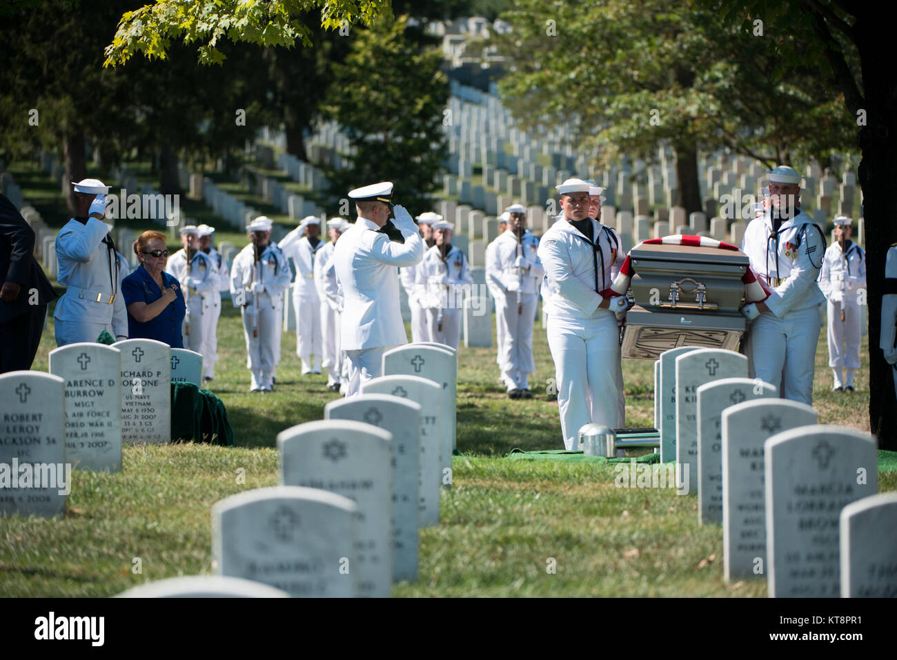 Members of the U.S. Navy participate in the graveside service for U.S ...