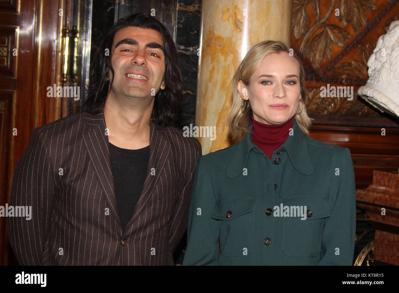 Diane Kruger and Fatih Akin signing the golden book at the townhall of ...