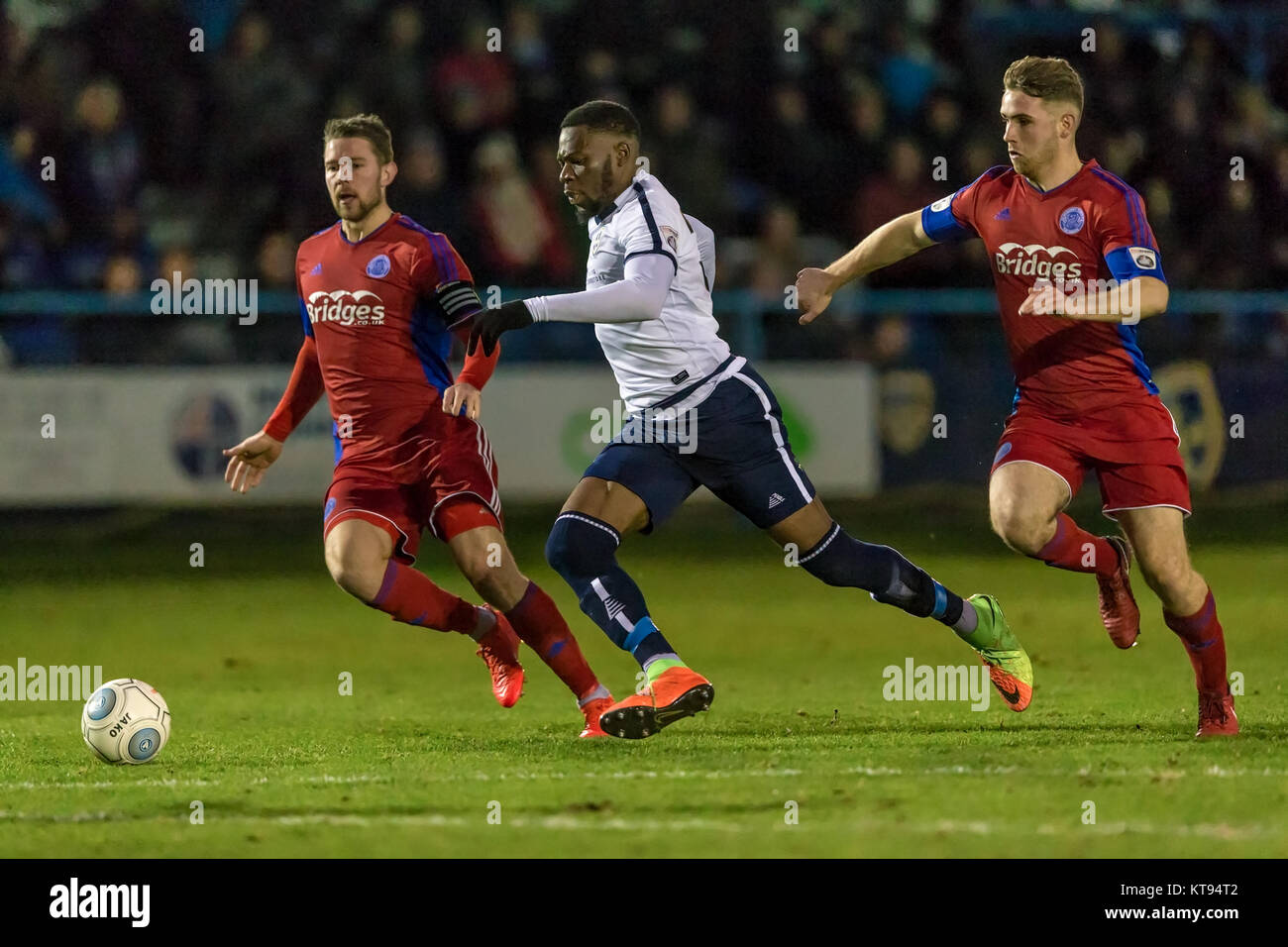 Guiseley, UK. 23rd Dec, 2017. Mike Fondop (Guiseley AFC) runs through ...