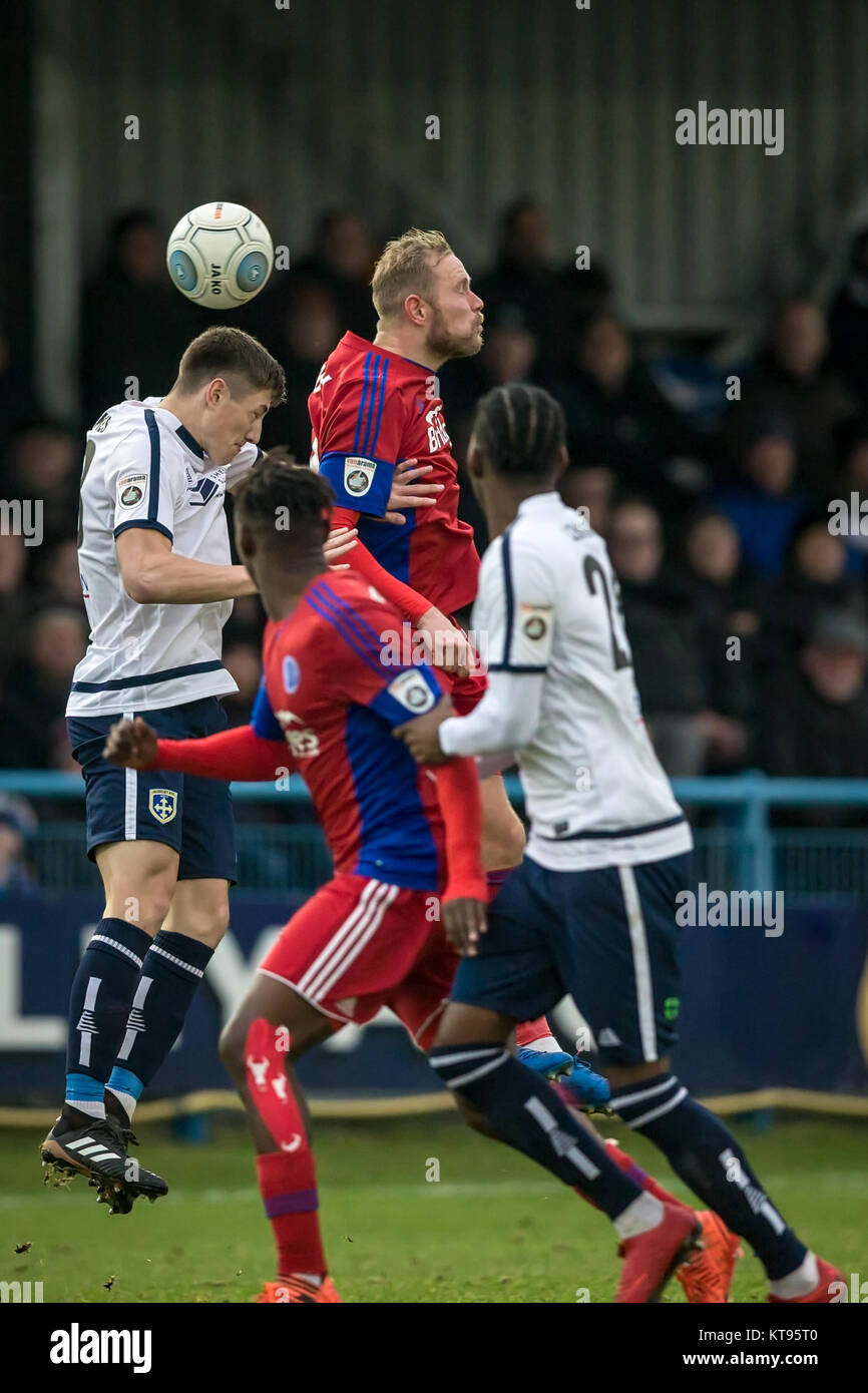 Guiseley, UK. 23rd Dec, 2017. Scott Rendell (Aldershot Town) wins a ...