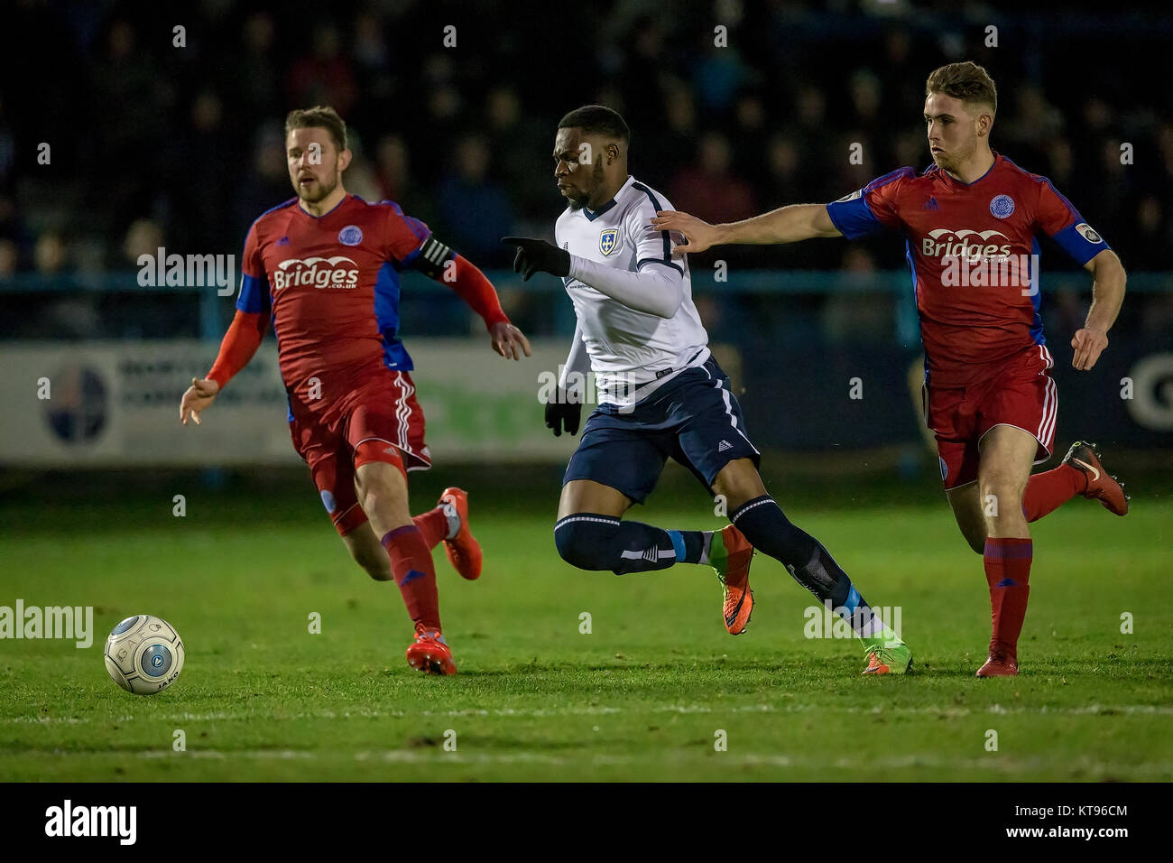 Guiseley, UK. 23rd Dec, 2017. Mike Fondop (Guiseley AFC) runs through ...