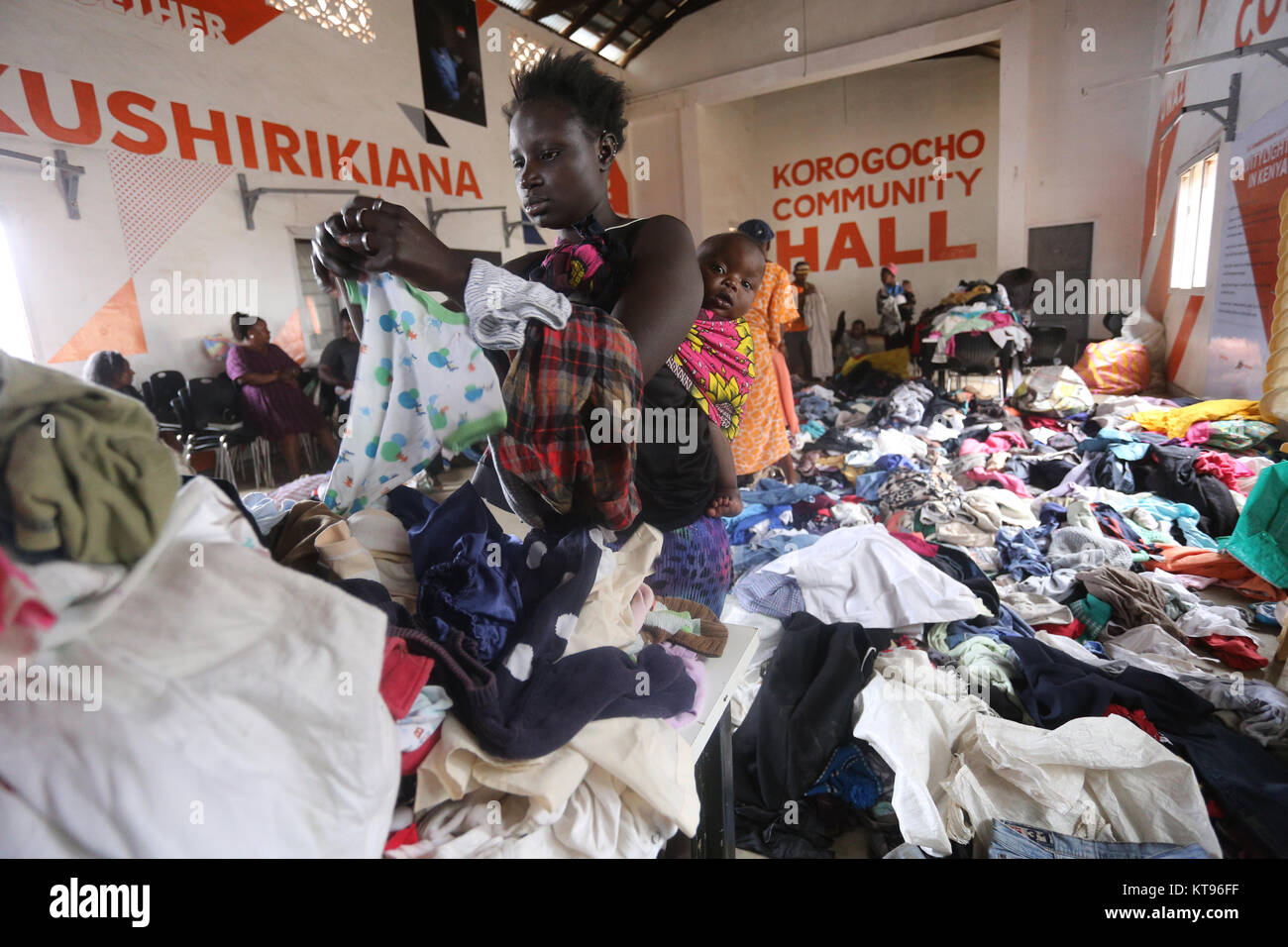 Woman sorting out clothing hi-res stock photography and images - Alamy