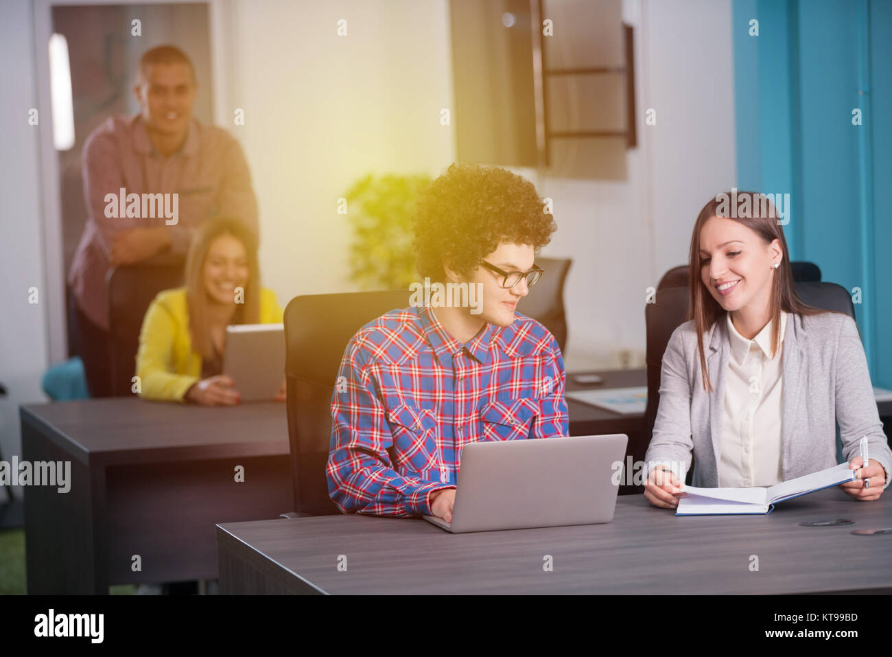 Portrait of startup group of creative people having a meeting with a ...