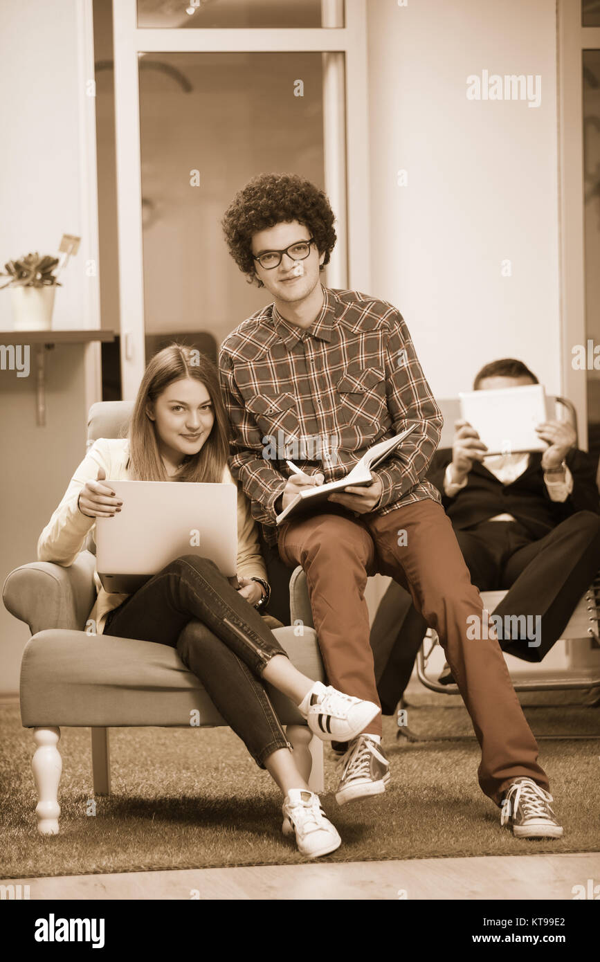 Portrait of startup group of creative people having a meeting with a ...