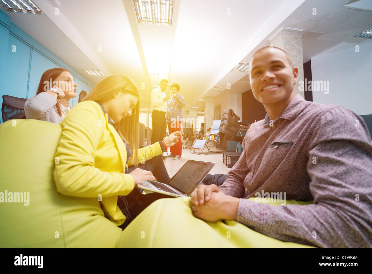 Portrait of startup group of creative people having a meeting with a ...