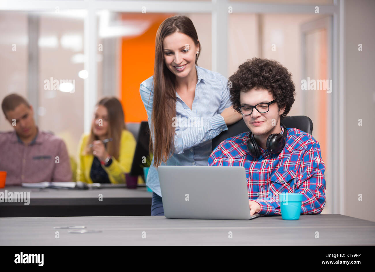 Portrait of startup group of creative people having a meeting with a ...