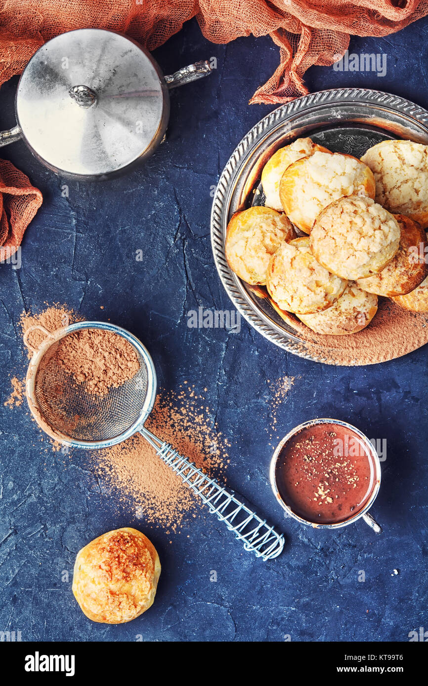 Homemade profiteroles dessert and cup hot cocoa Stock Photo - Alamy