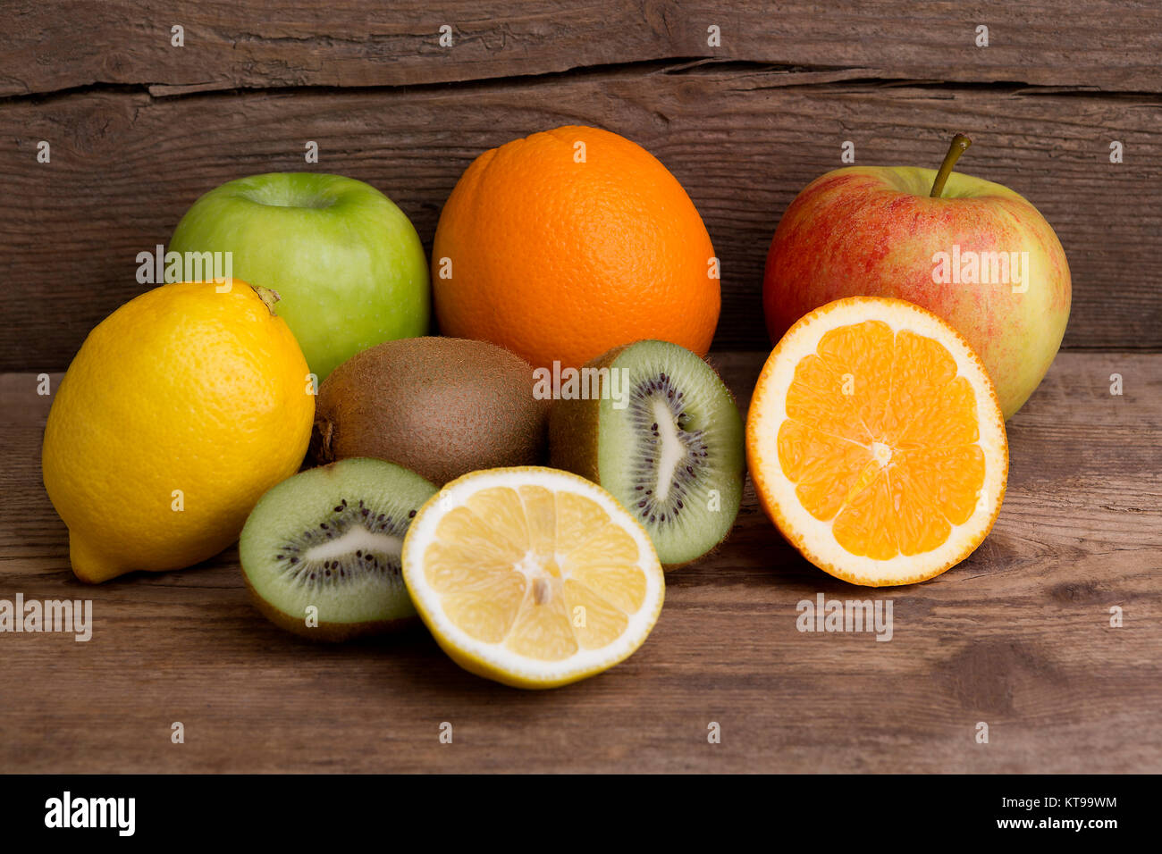 Variations of fruits on a wooden background Stock Photo - Alamy
