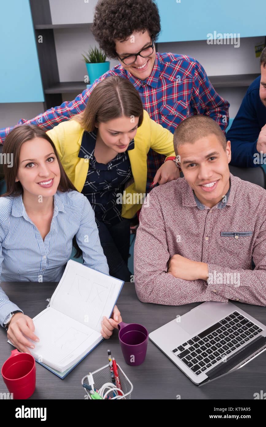 Portrait of startup group of creative people having a meeting with a ...