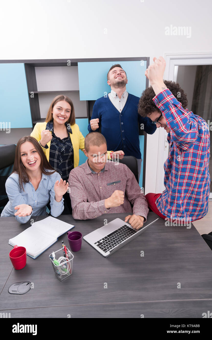 Portrait of startup group of creative people having a meeting with a ...