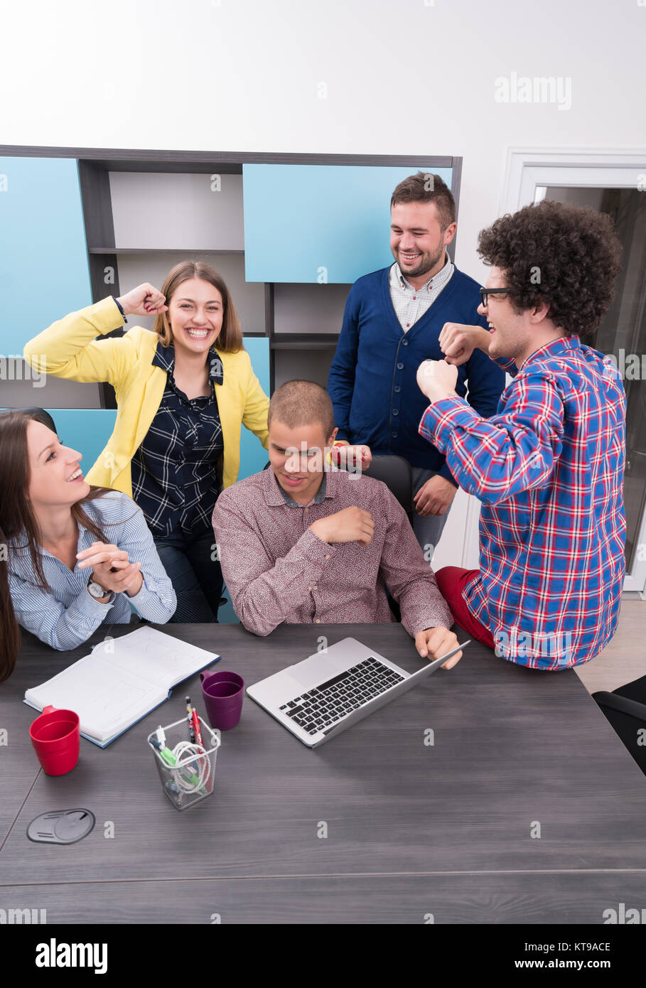 Portrait of startup group of creative people having a meeting with a ...