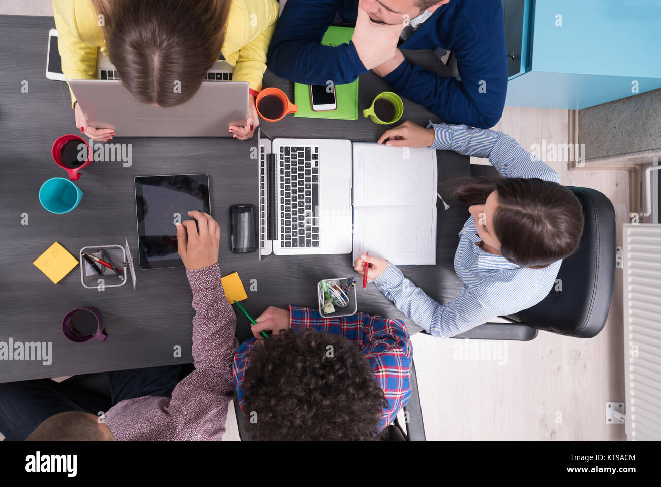 Portrait of startup group of creative people having a meeting with a ...