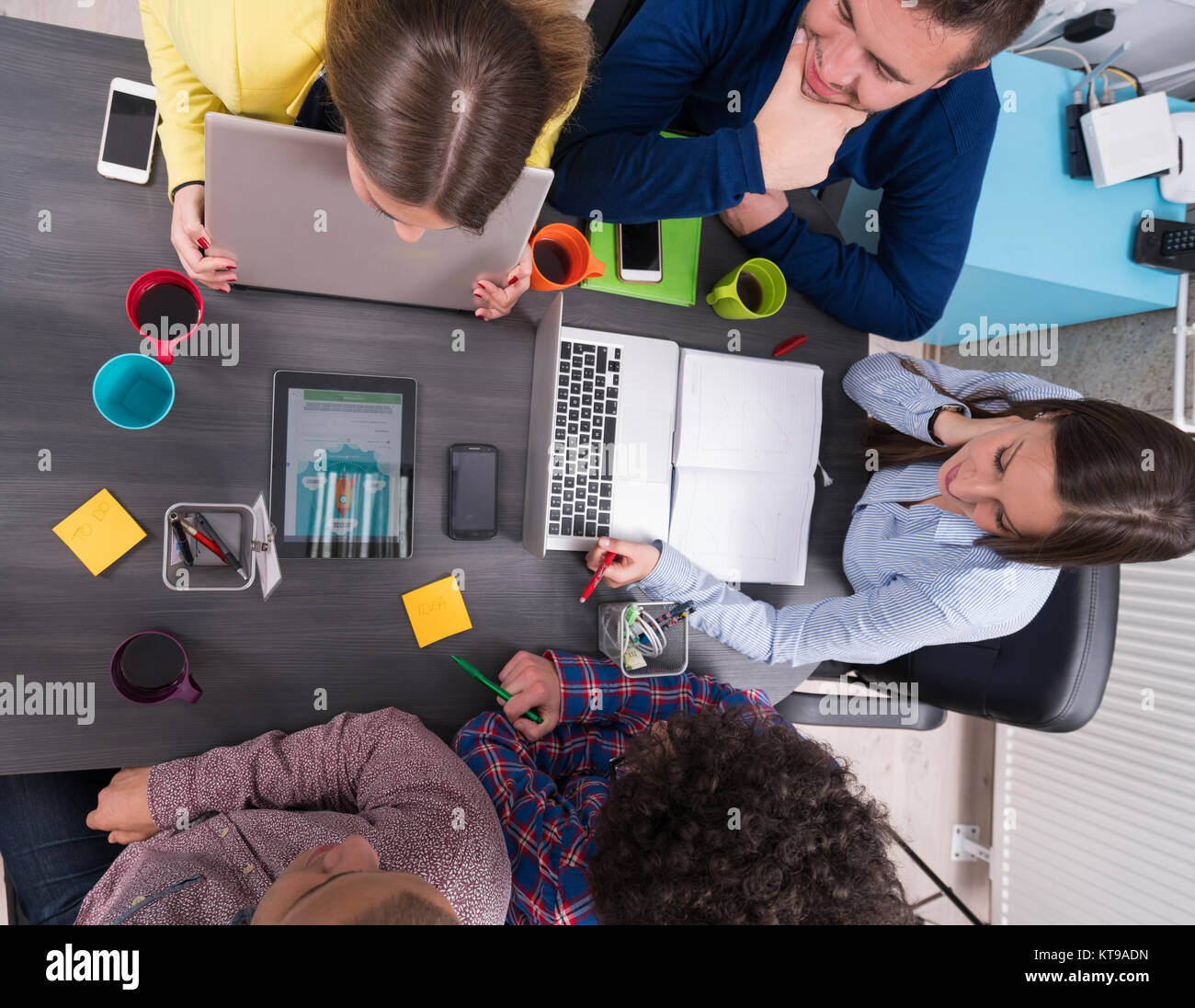 Portrait of startup group of creative people having a meeting with a ...